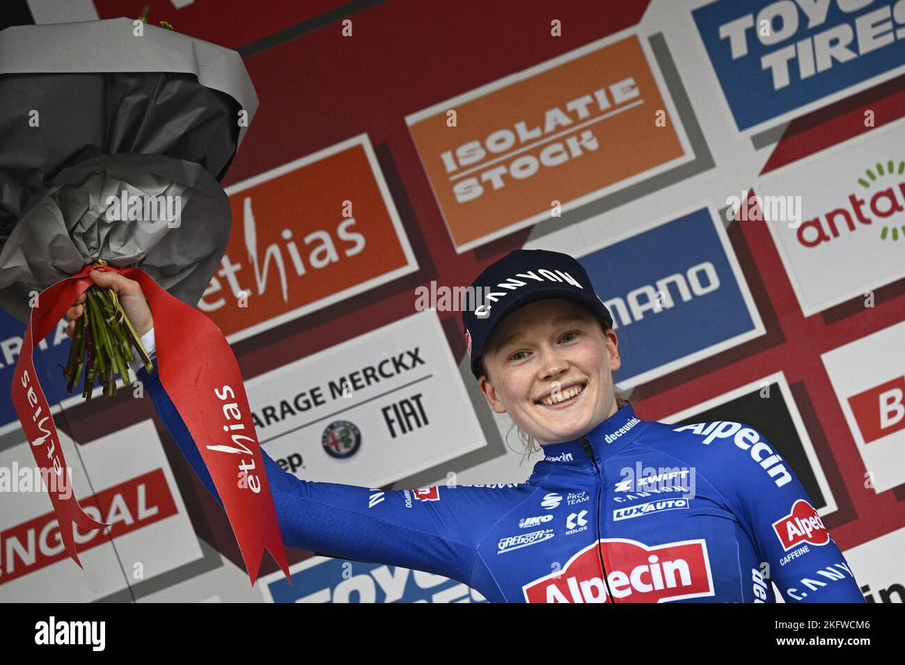 Dutch Puck Pieterse celebrates on the podium after winning the women's ...
