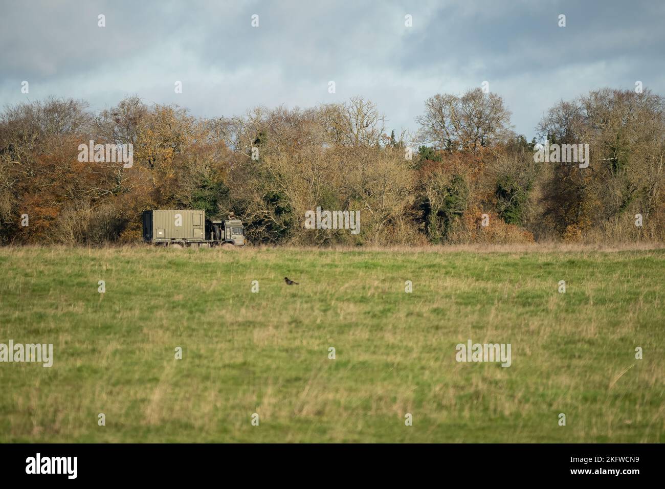 British army MAN SV 4x4 logistics truck with armed rooftop soldier in ...