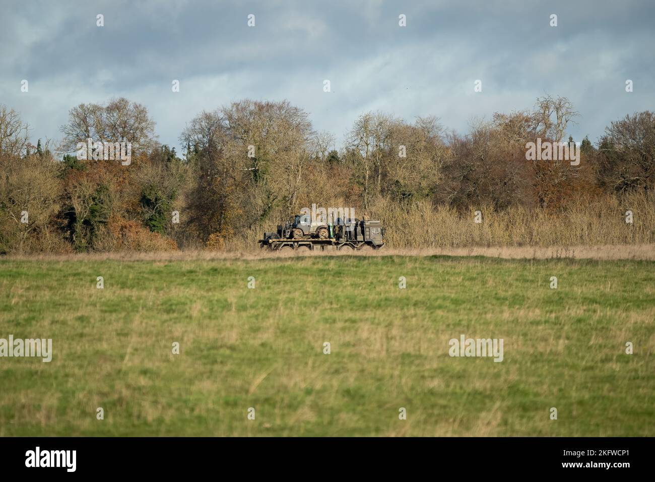 British army MAN HX77 8x8 logistics truck with armed rooftop soldier in ...