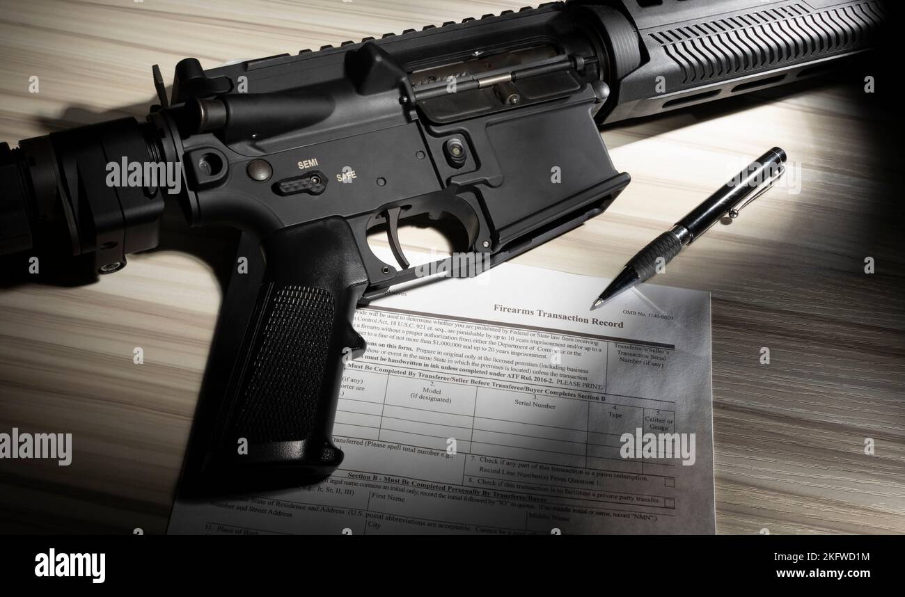 AR-15 with public domain purchase document and pen Stock Photo - Alamy