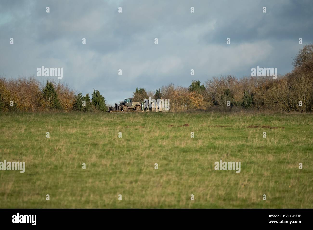 British army MAN HX77 8x8 logistics truck with armed rooftop soldier in ...