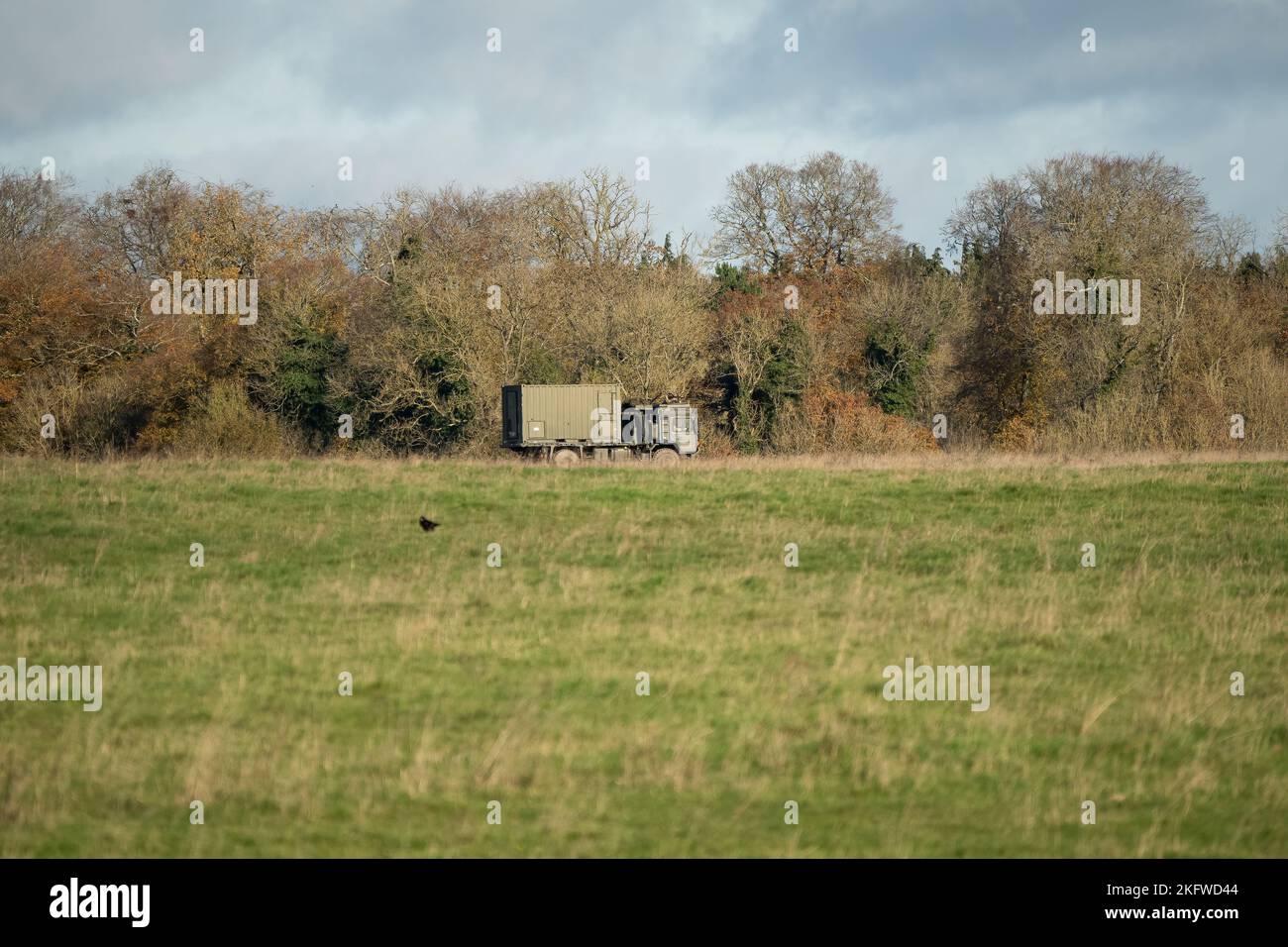 British army MAN SV 4x4 logistics truck with armed rooftop soldier in ...
