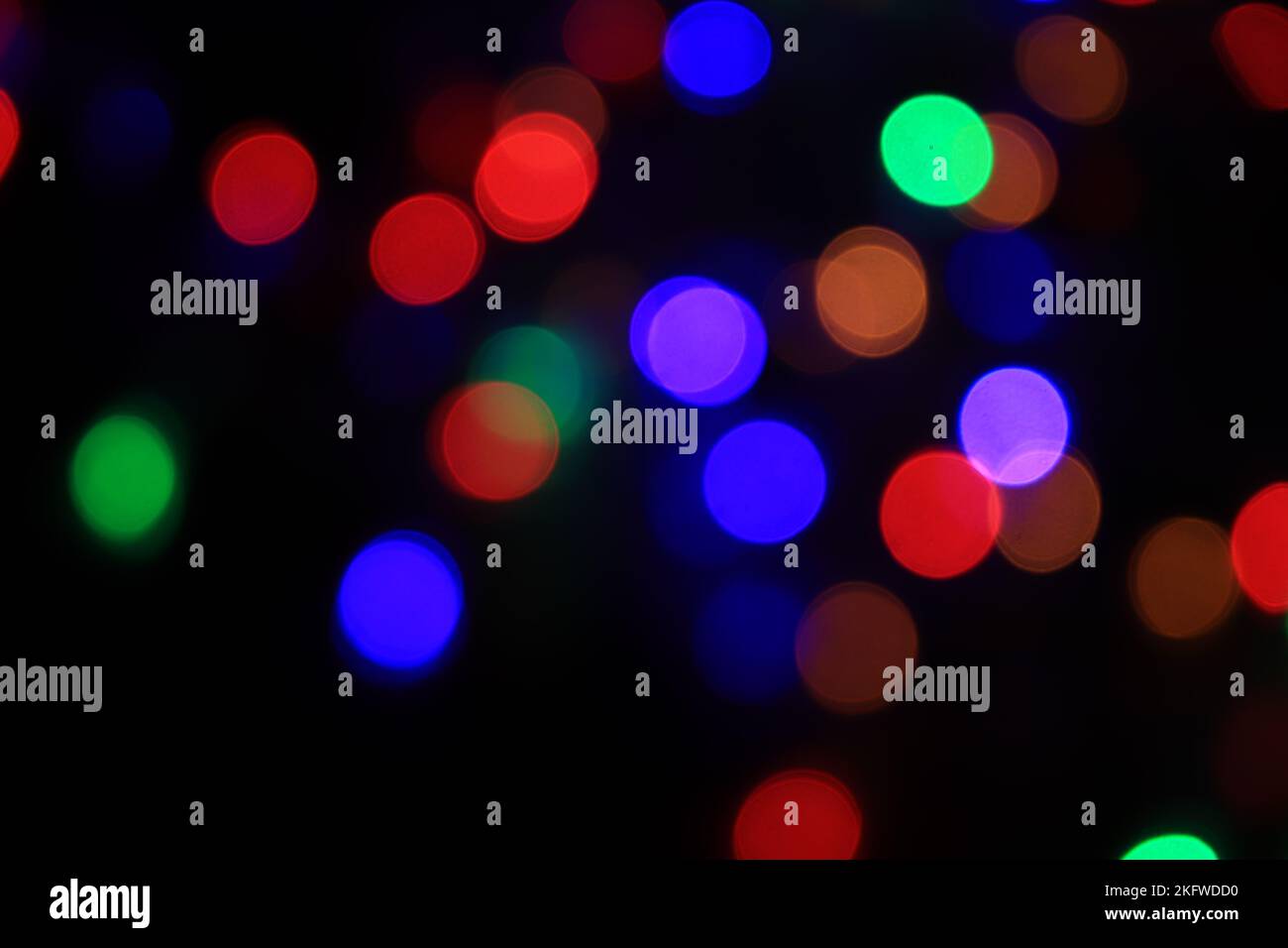 abstract blurred of blue and silver glittering shine bulbs lights ...