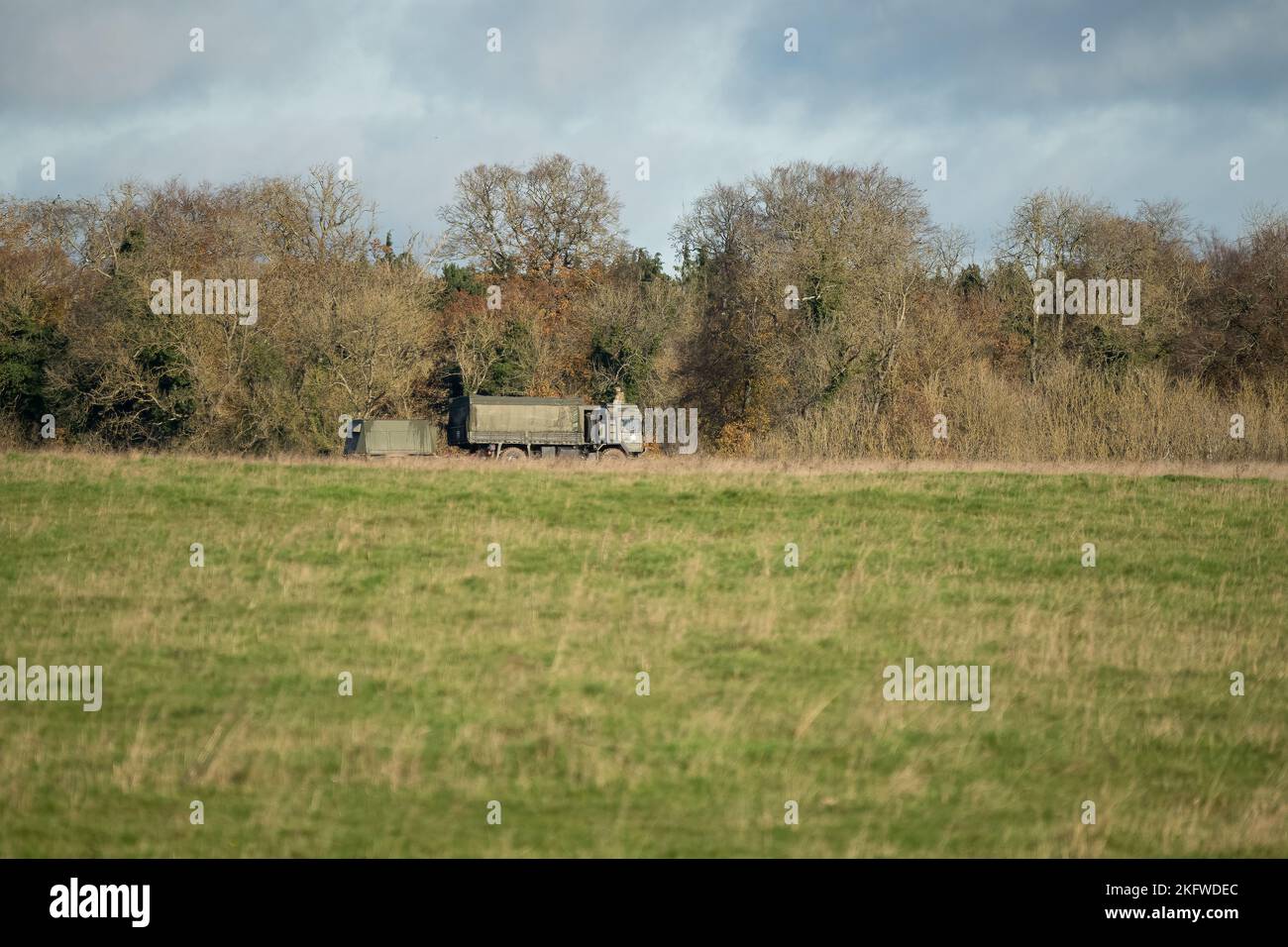 British army MAN SV 4x4 logistics truck with armed rooftop soldier in ...