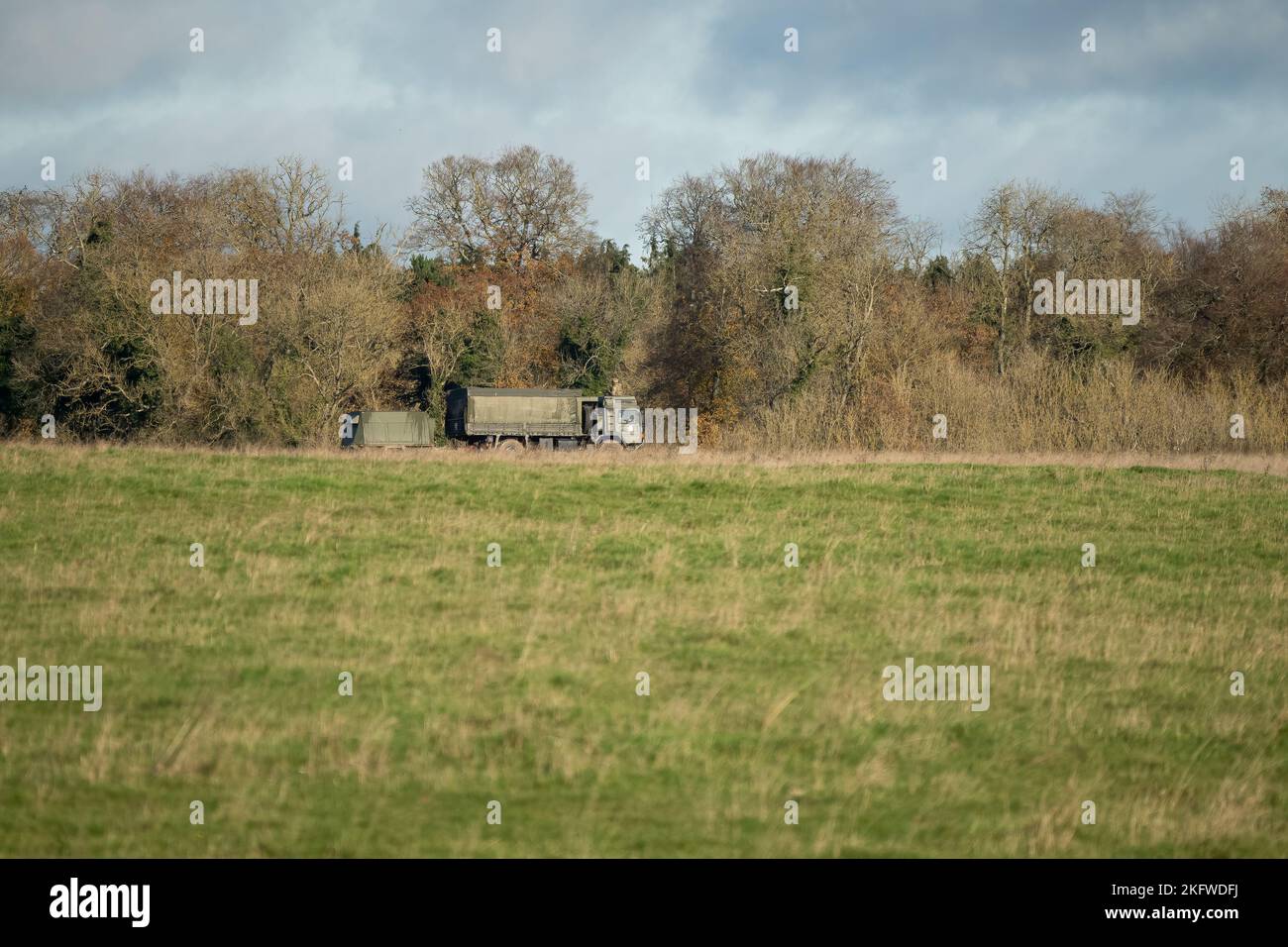British army MAN SV 4x4 logistics truck with armed rooftop soldier in ...