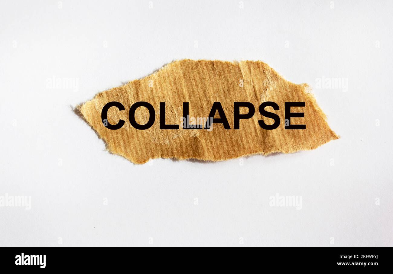 The word COLLAPSE, on a piece of brown paper and a white background ...