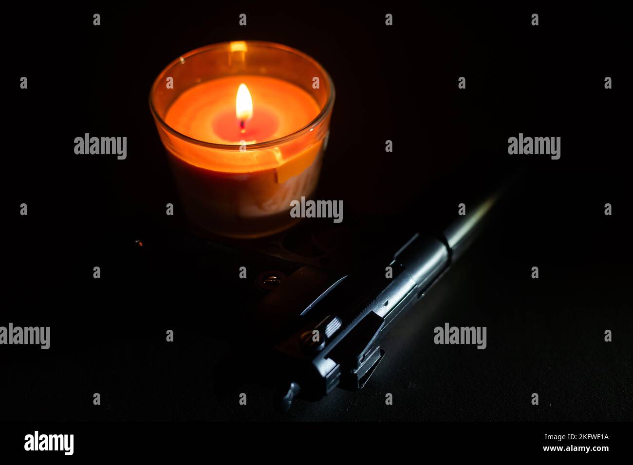 candle and a gun, criminal, crime, murder, weapons Stock Photo - Alamy