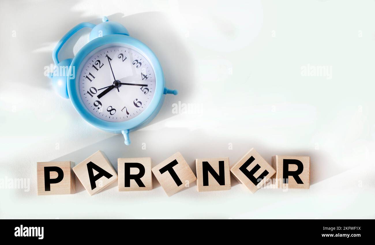 Word PARTNER from building wooden blocks on a light background with a ...