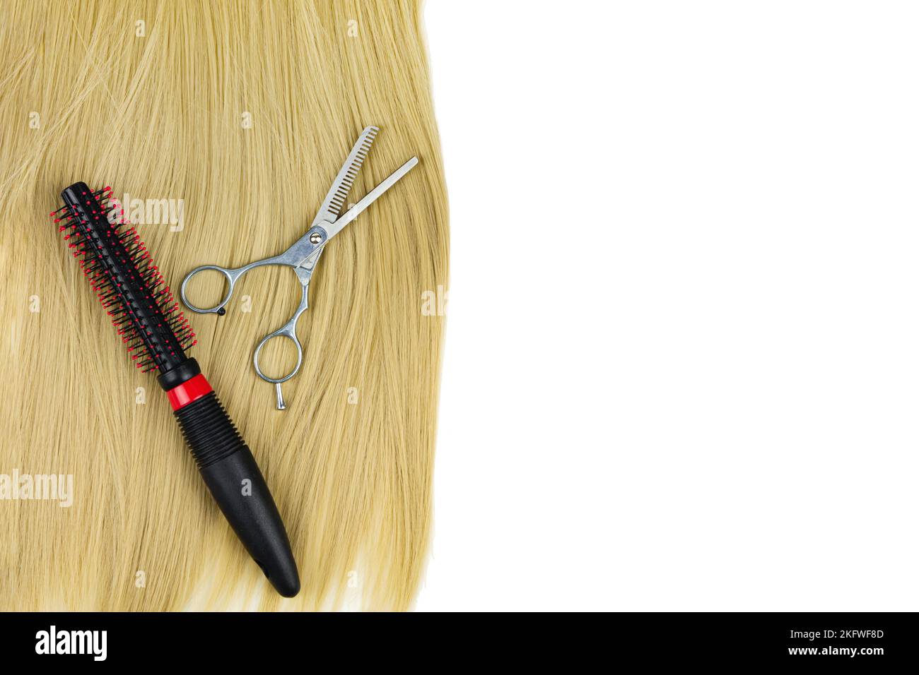 Curling brush on blonde hair with scissors on white background. Hair ...