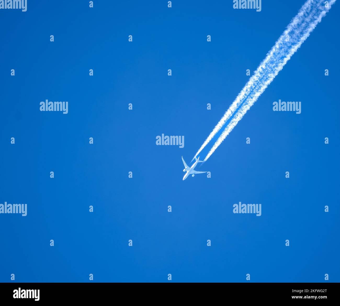 high altitude twin engine contrails (jet airplane vapour trails) across ...