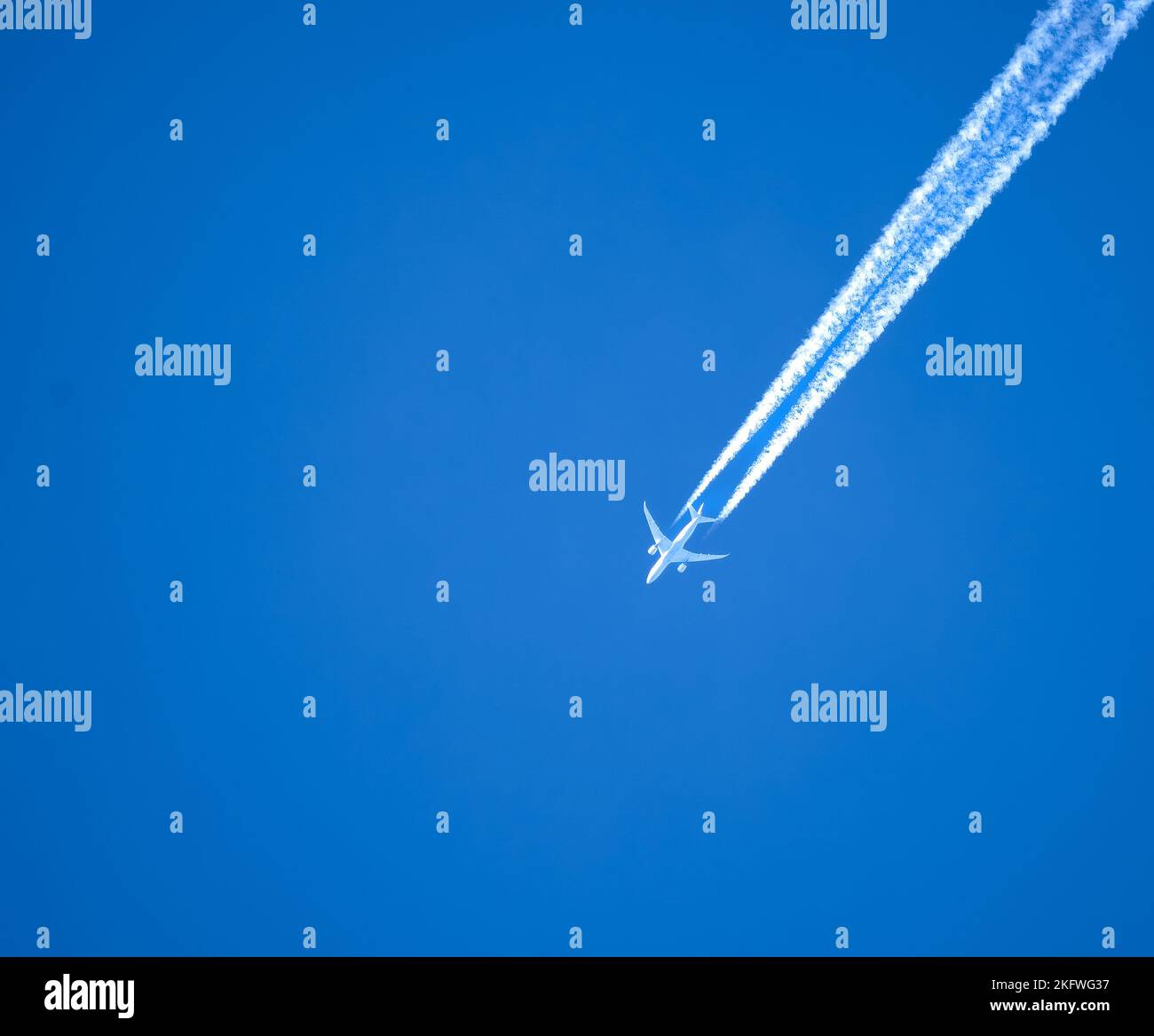 high altitude twin engine contrails (jet airplane vapour trails) across ...