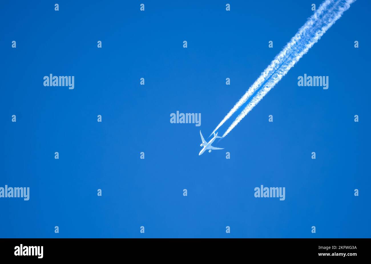 high altitude twin engine contrails (jet airplane vapour trails) across ...