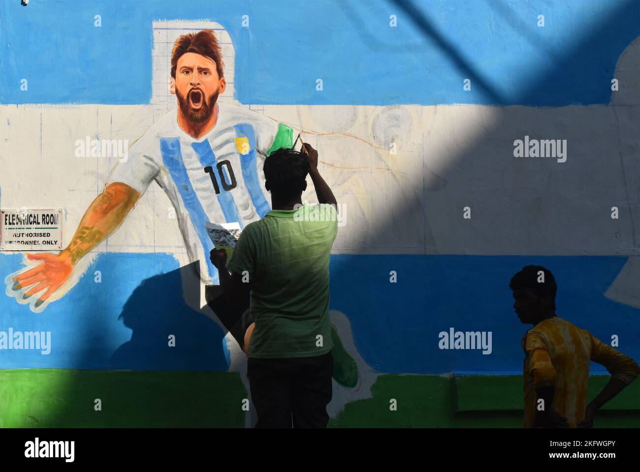 A painter draws an image of Argentina's soccer player Lionel Messi, on ...