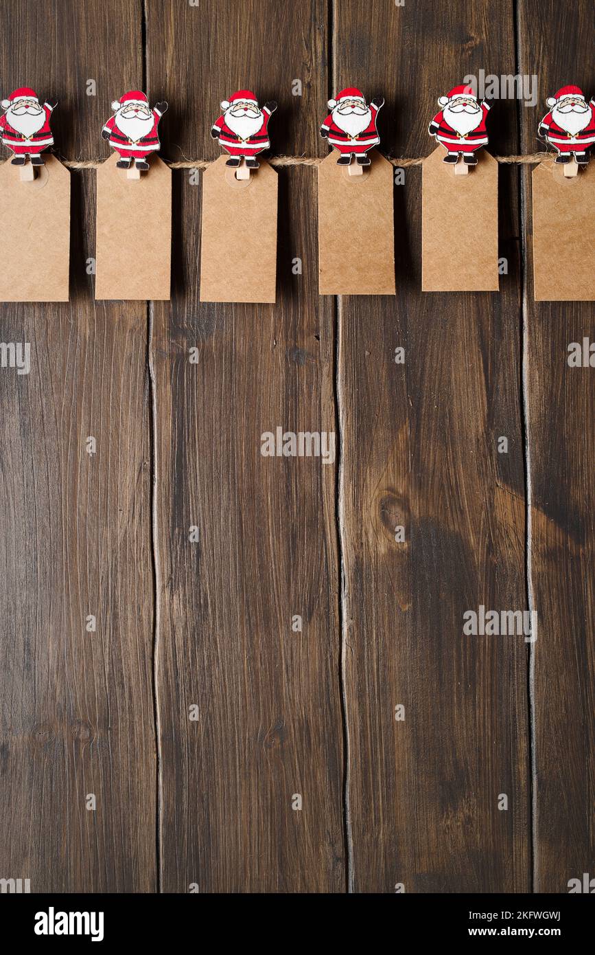 Clothespins with Santa Claus decoration and writable labels, on a ...