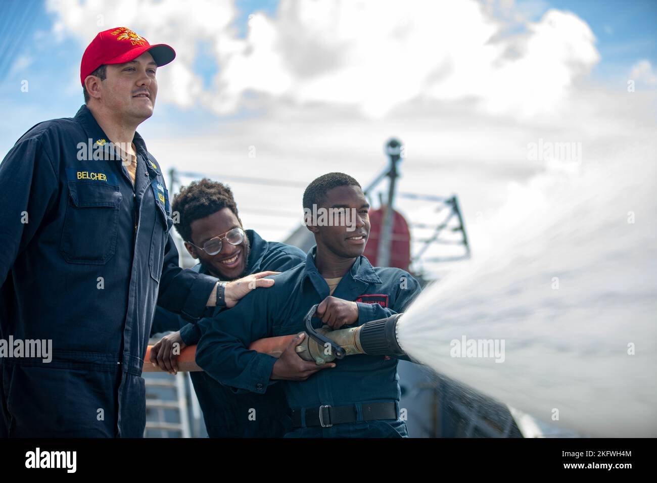 Chief Damage Controlman Jordan Belcher, left, assigned to the Arleigh ...
