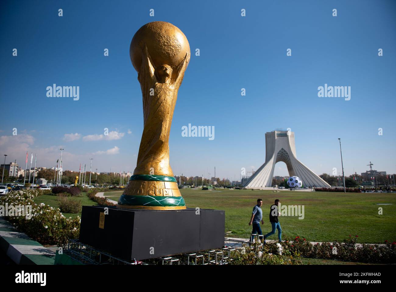 Sculptures of the FIFA World Cup trophy and a soccer ball are placed ...