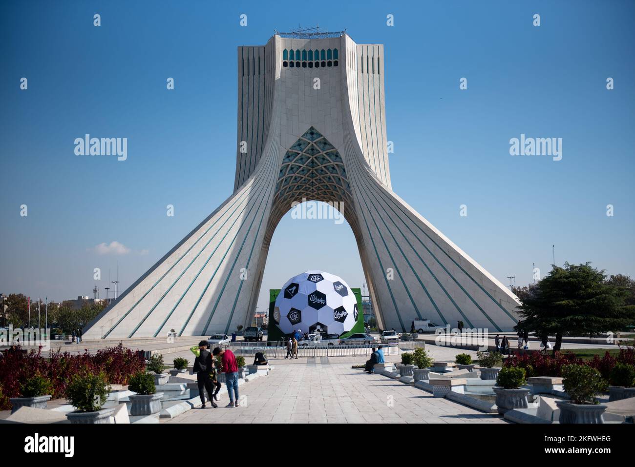 Sculpture of a soccer ball is placed next to the Azadi (Freedom ...