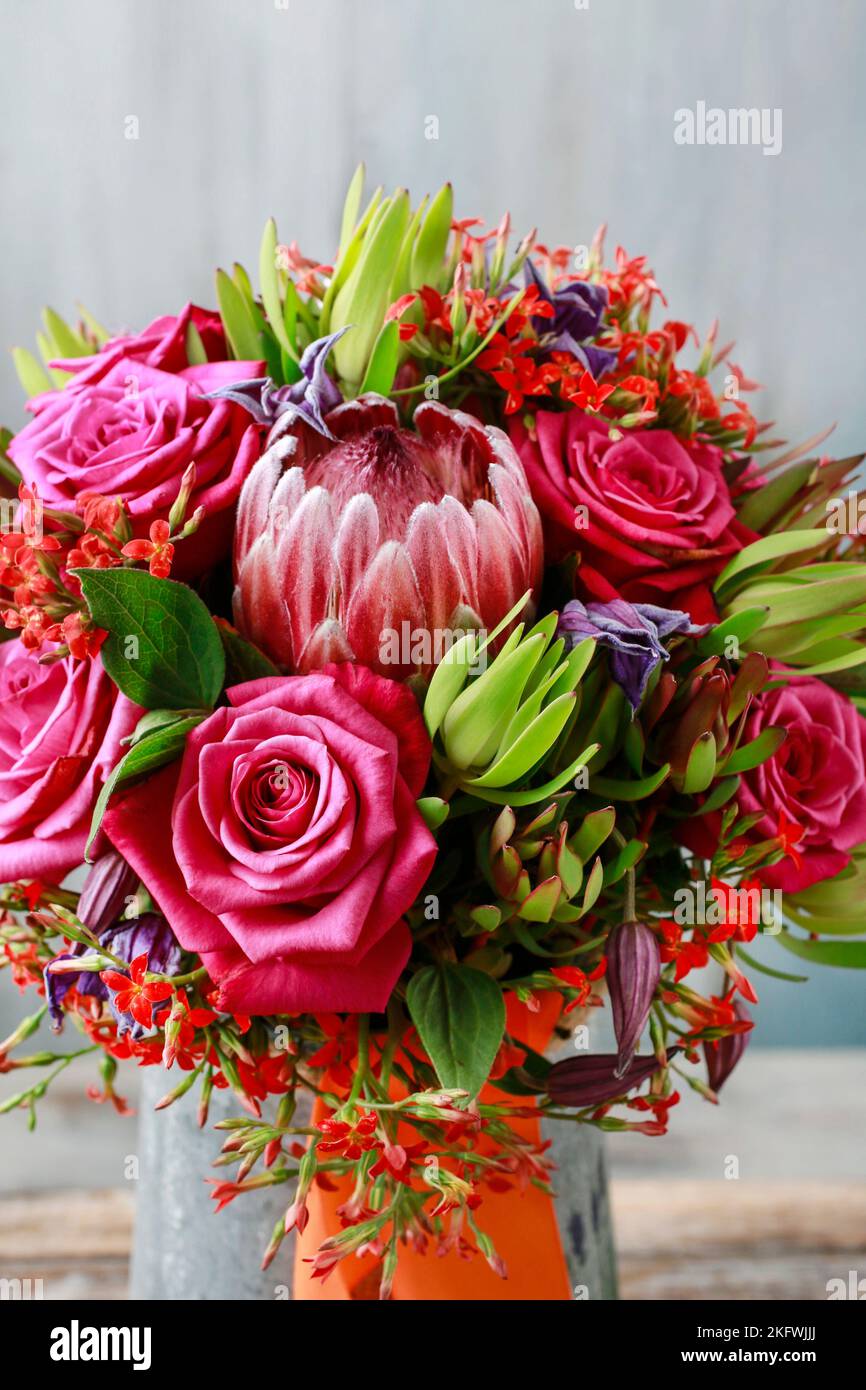 Rose and protea flowers in wedding bouquet. Party decor Stock Photo - Alamy
