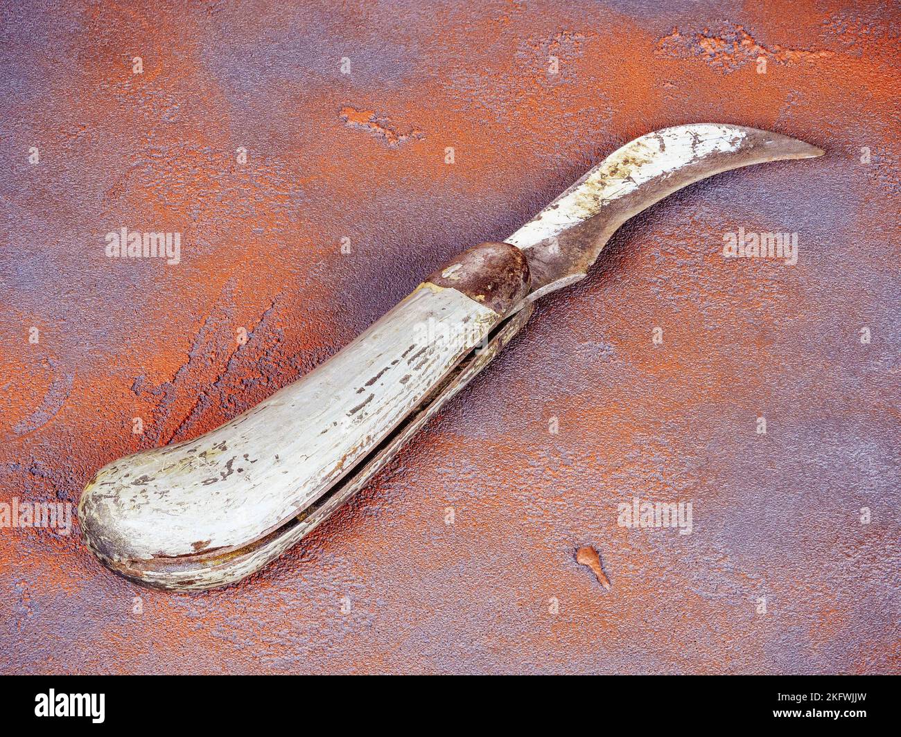 Vintage rusty folding knife on a grunge orange background Stock Photo ...