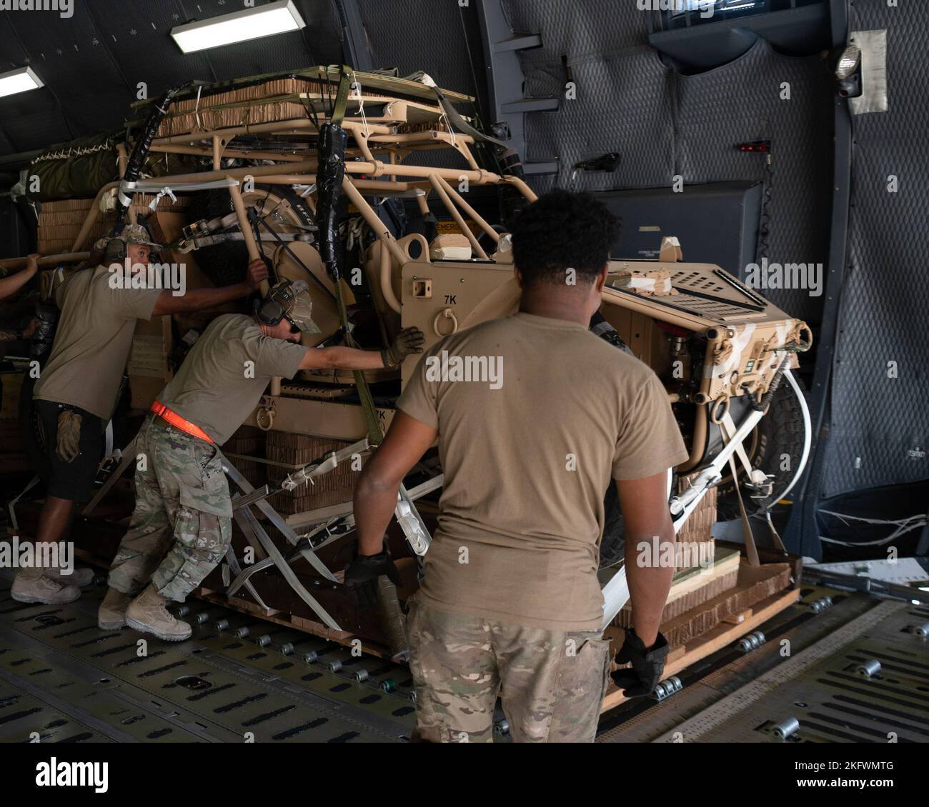 Airmen from the 60th Air Mobility Wing, Travis Air Force Base., unload ...