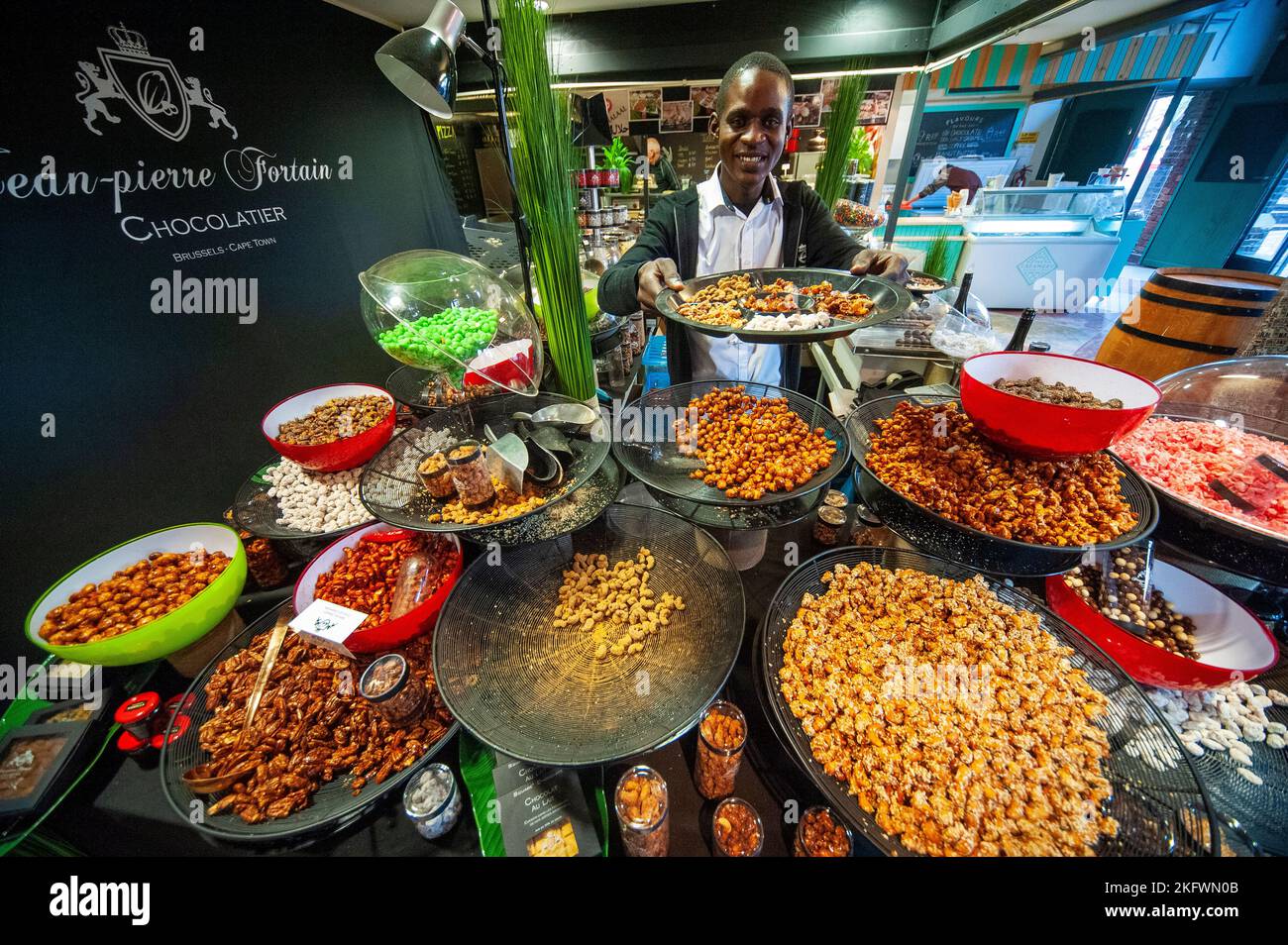 Tourists enjoying snacks at the V & A Foodmarket, V & A Waterfront ...