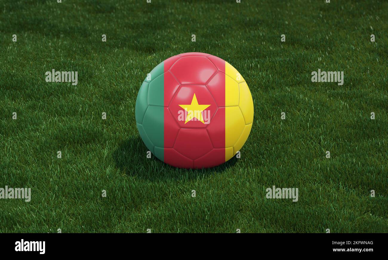Soccer ball with Cameroon flag colors at a stadium on green grasses ...