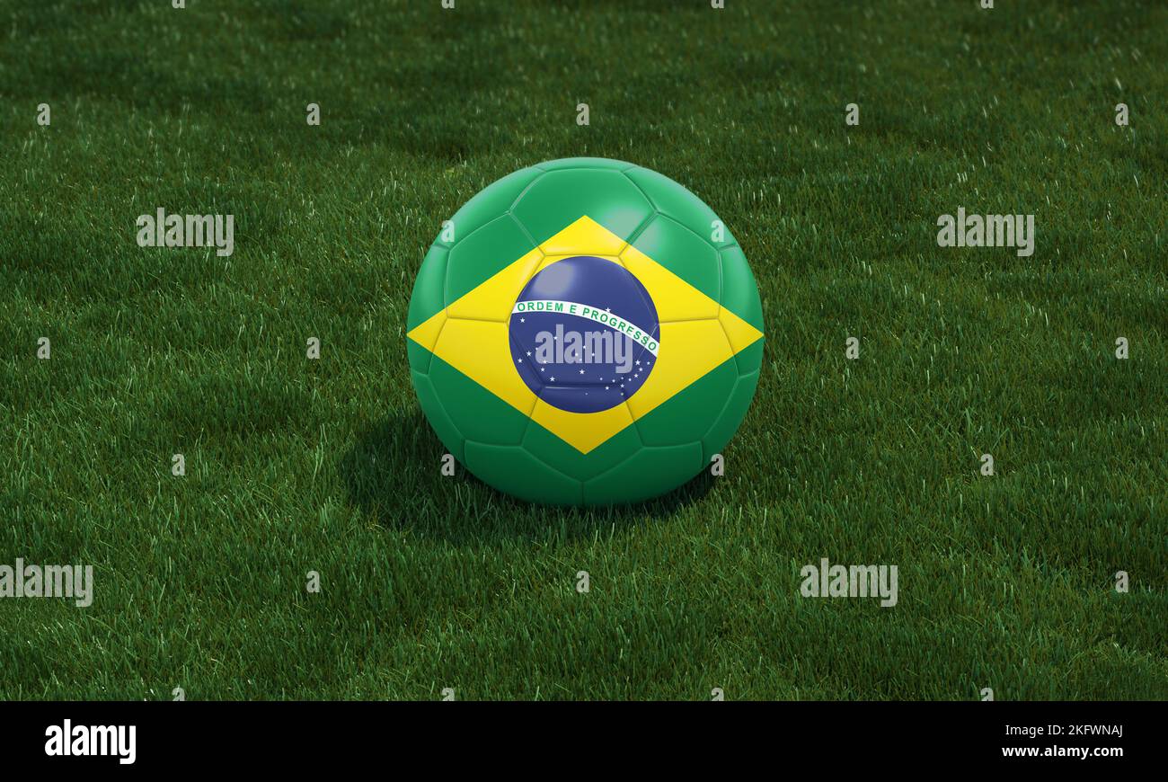 Soccer ball with Brazil flag colors at a stadium on green grasses ...