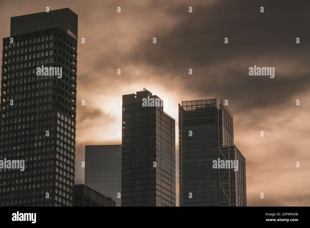 A low-angle view of modern buildings during sunset in NYC, USA Stock ...