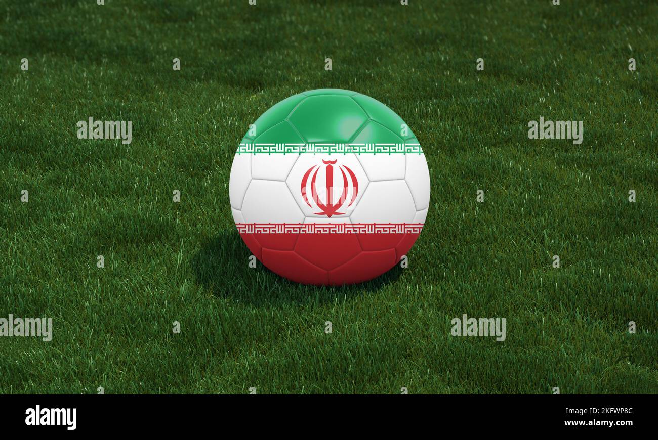 Soccer ball with Iran flag colors at a stadium on green grasses ...