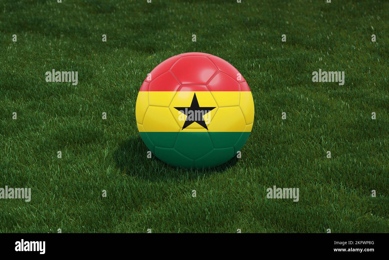 Soccer ball with Ghana flag colors at a stadium on green grasses ...