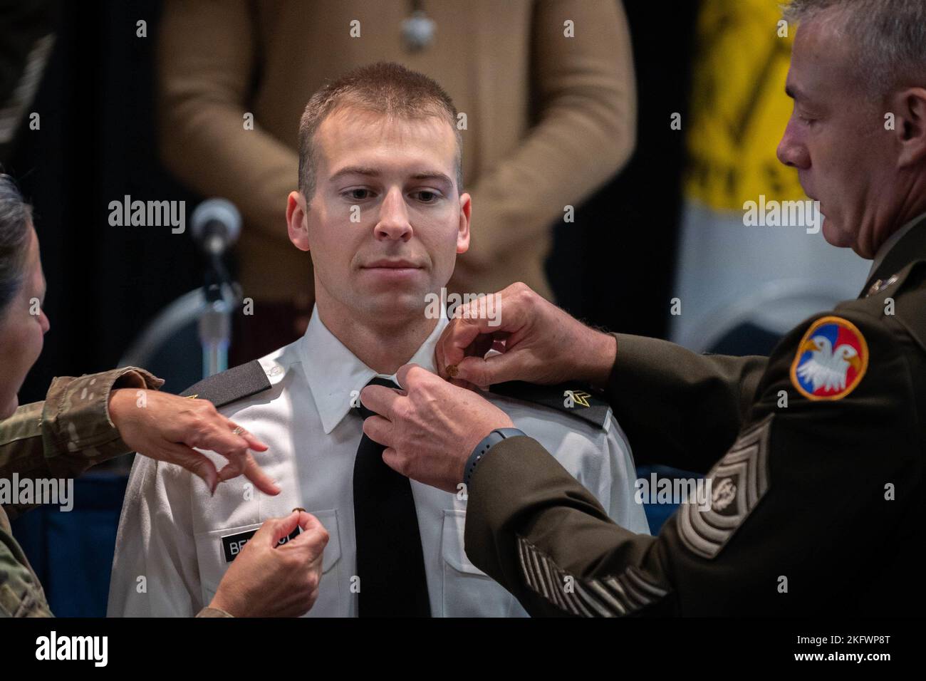 Army Reserve Spc. Brady A. Benedict (center), a military policeman ...