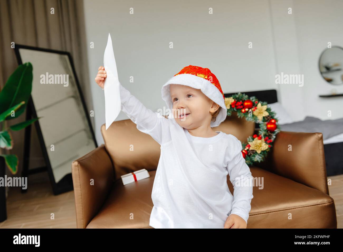 The little boy is holding a letter to Santa Claus. Christmas mood to ...
