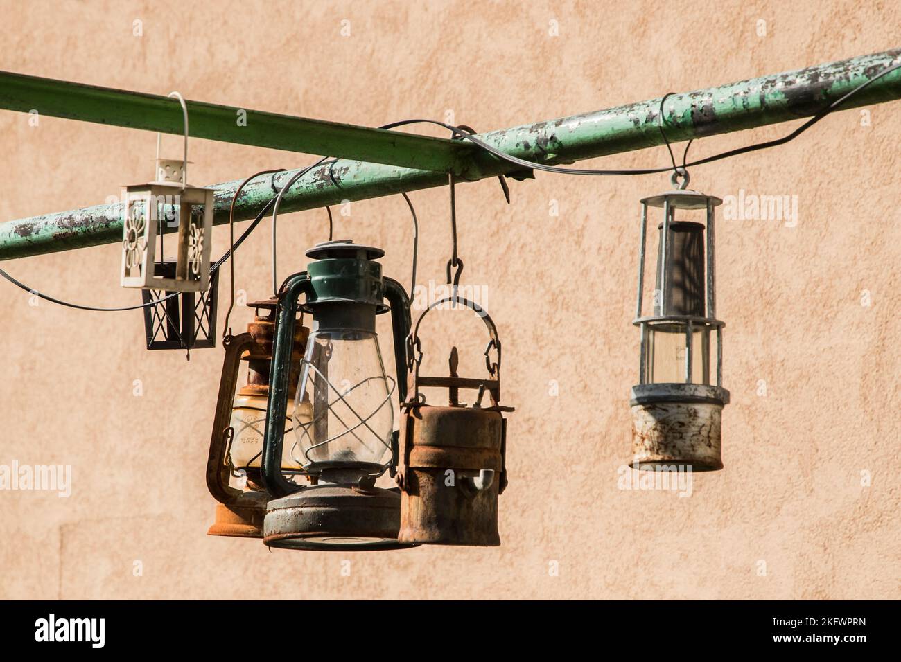 Hanging old used vintage gas lamps in house garden closeup in sunny day ...