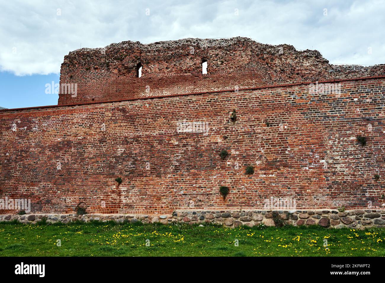 ruins of a medieval castle with brick defensive walls in the city of ...