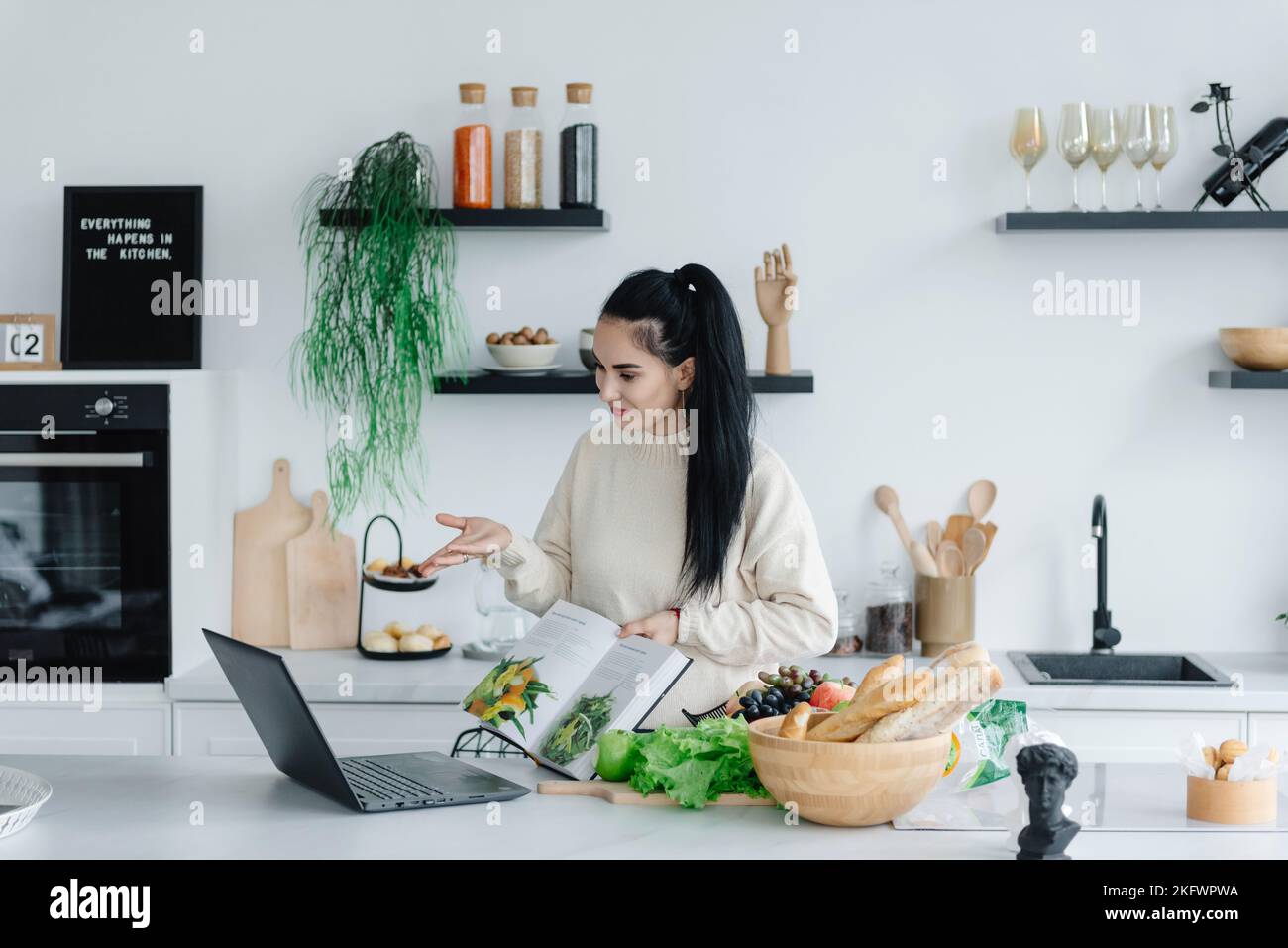 A pretty young woman food blogger is streaming and live-streaming ...