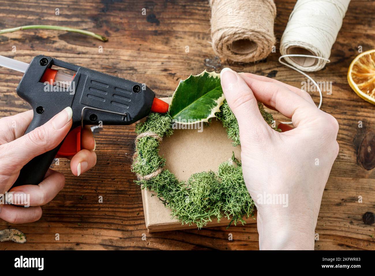 Wrapping Christmas gifts. Hobby time Stock Photo - Alamy