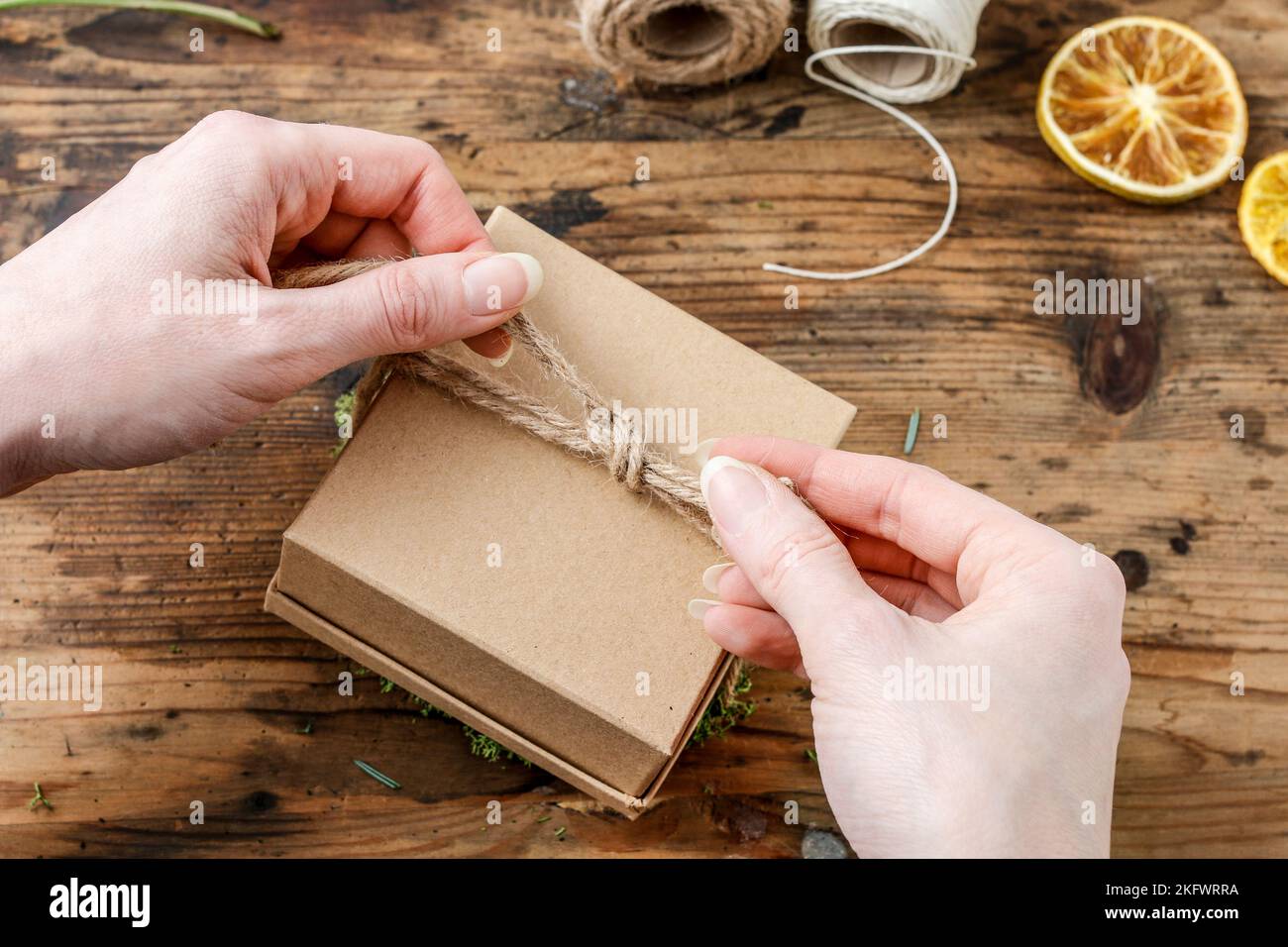 Wrapping Christmas gifts. Hobby time Stock Photo - Alamy