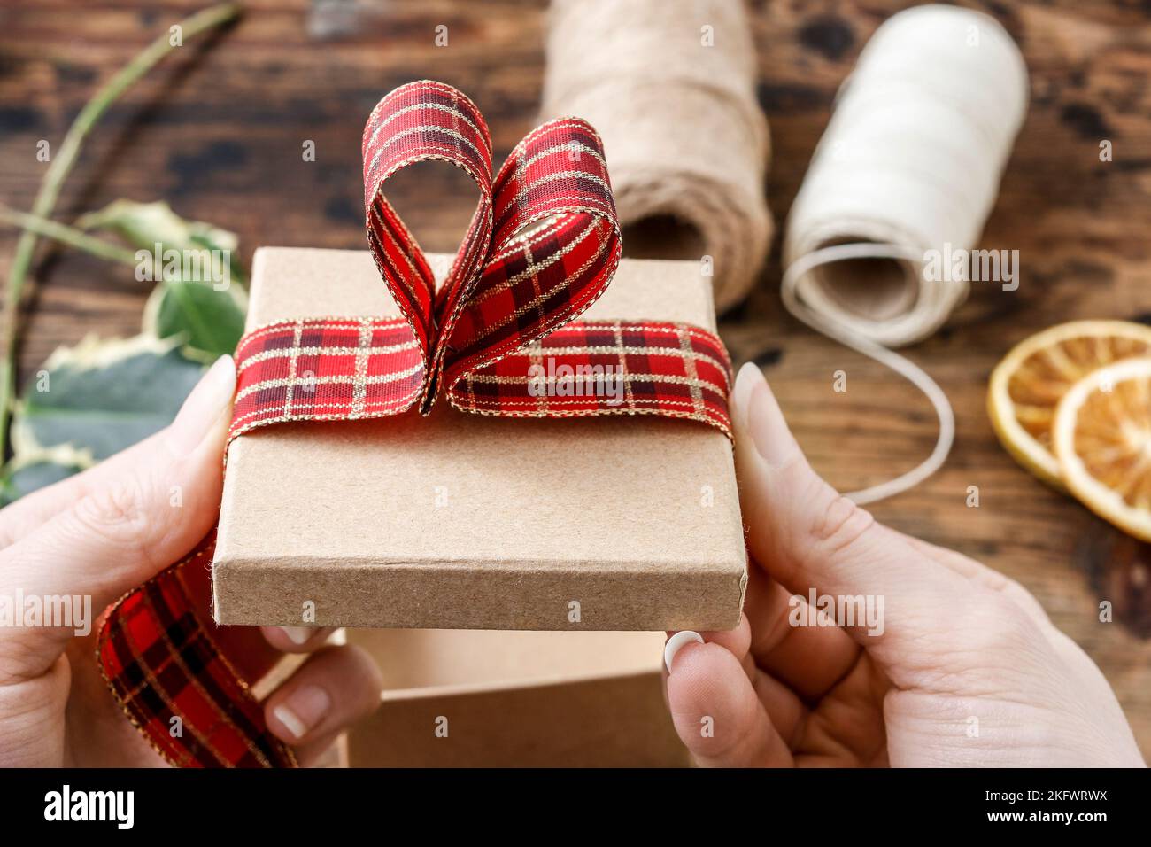Wrapping Christmas gifts. Hobby time Stock Photo - Alamy