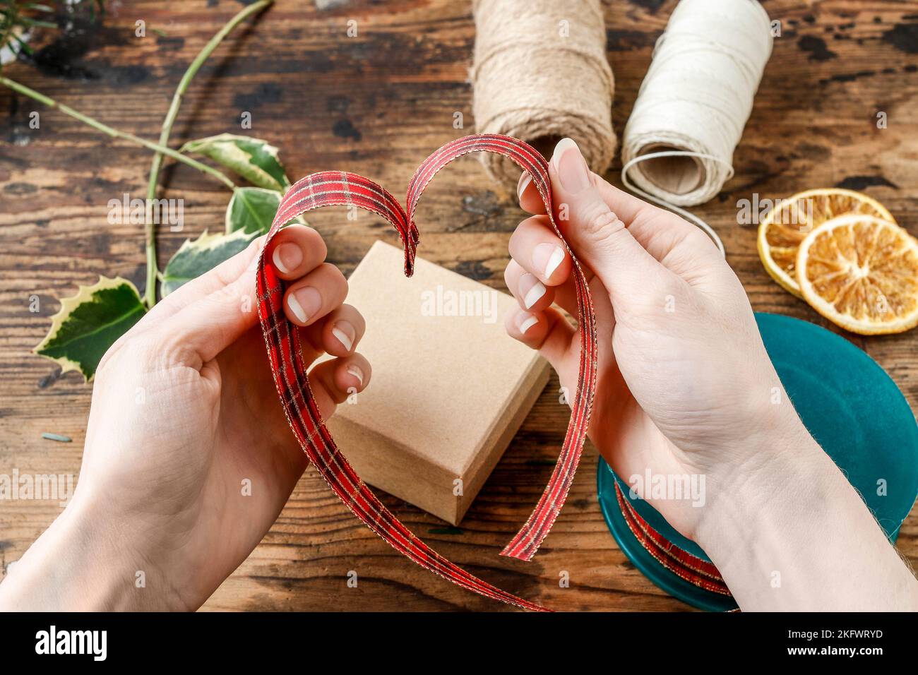Wrapping Christmas gifts. Hobby time Stock Photo - Alamy