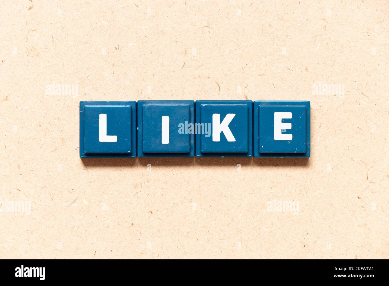 Tile letter in english word like on wood background Stock Photo - Alamy