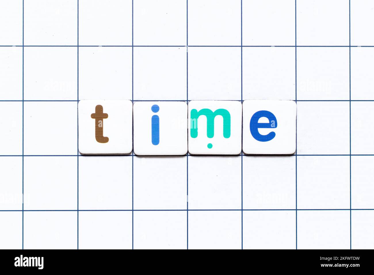 Colorful tile letter in word time on white grid background Stock Photo ...
