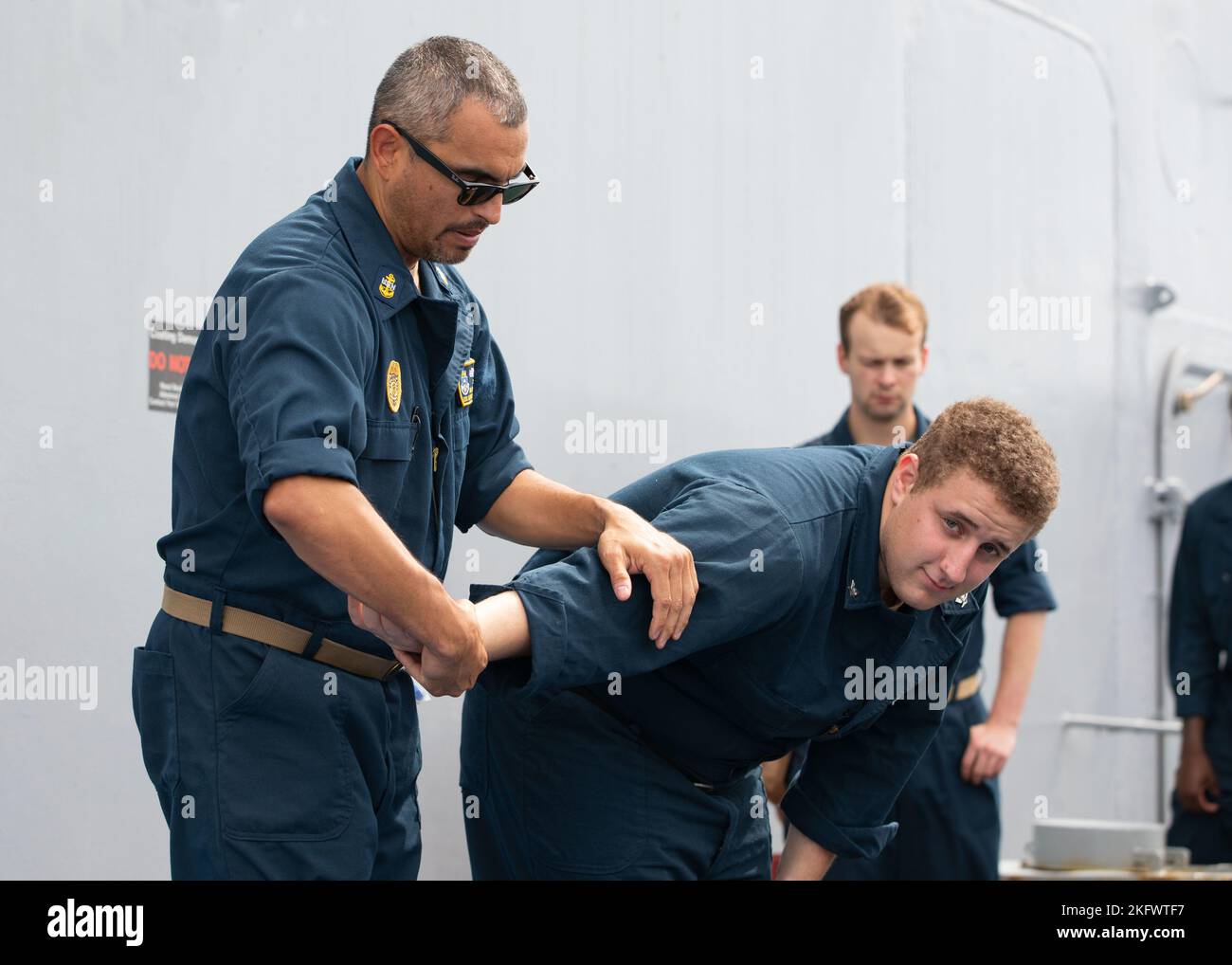 221012-N-LK647-1117 ATLANTIC OCEAN—Chief Master-at-Arms Darren Javines, left, and Sonar ...