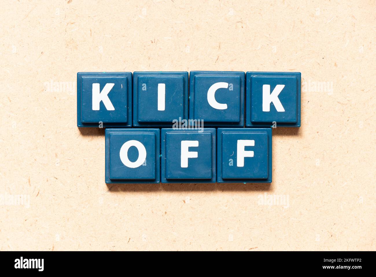 Tile letter in english word kick off on wood background Stock Photo - Alamy