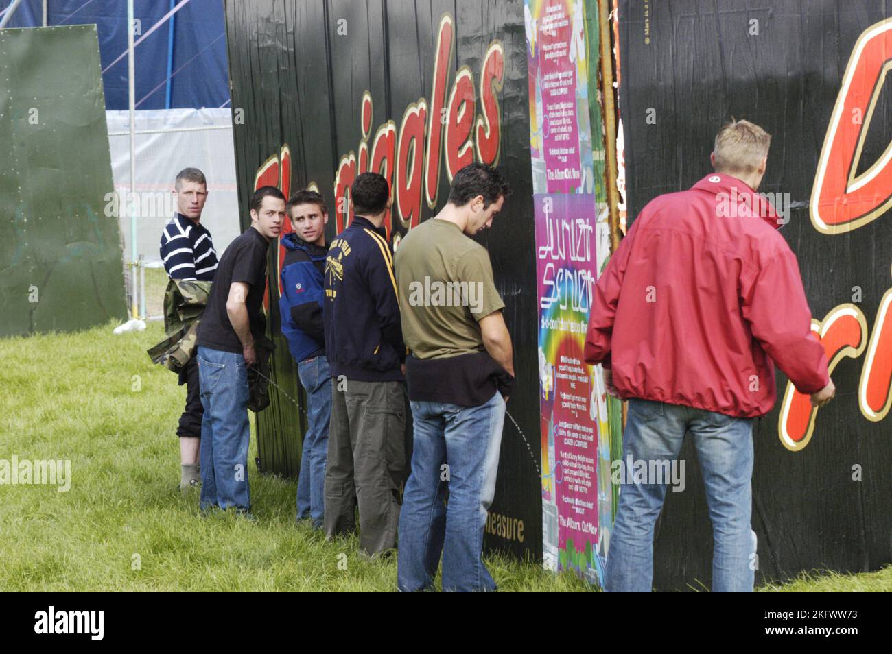 Men peeing at Homelands Festival near Winchester, England, May 24 2003 ...