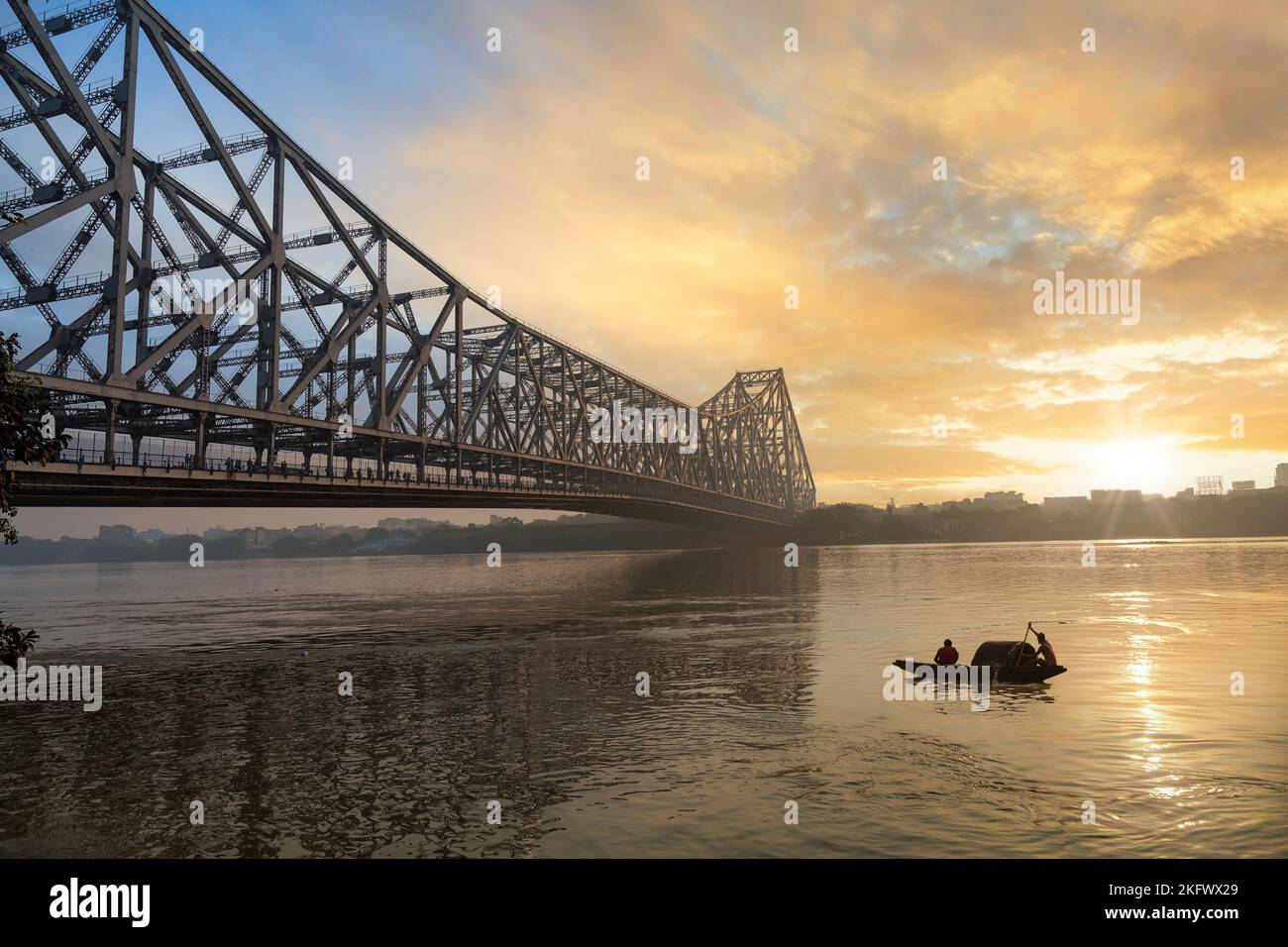 Howrah bridge at sunrise. A famous cantilever bridge built on river ...