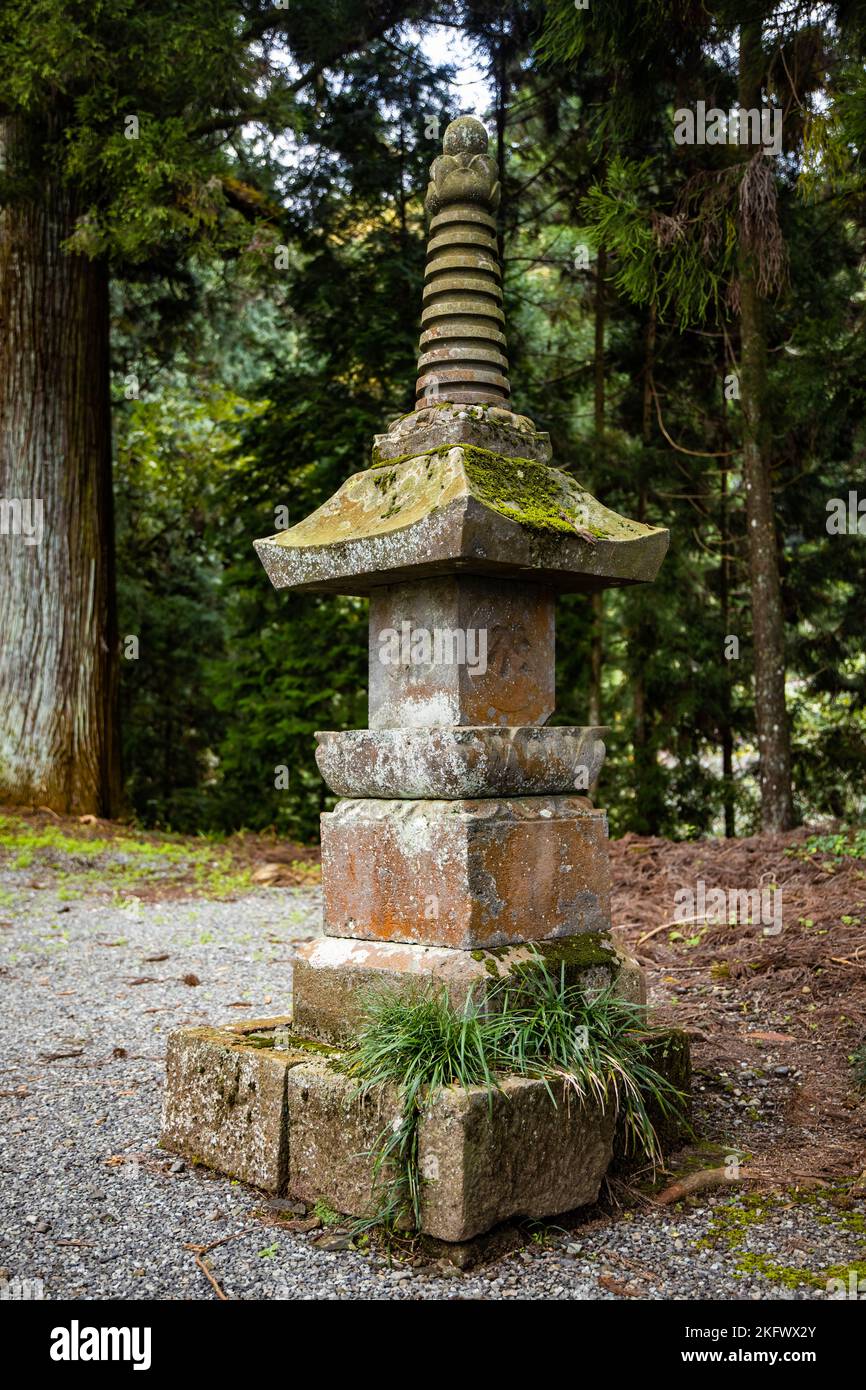 Ancient stone toro lanterns at the temple forest close up Stock Photo ...