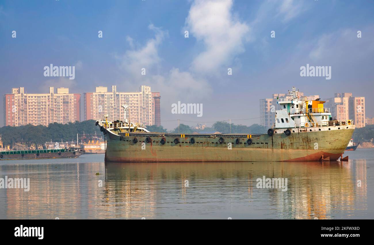Cargo ship on river Ganges with view of Kolkata cityscape Stock Photo ...