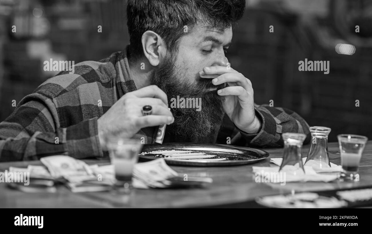 Guy holds rolled banknote, defocused background. Man with busy face ...