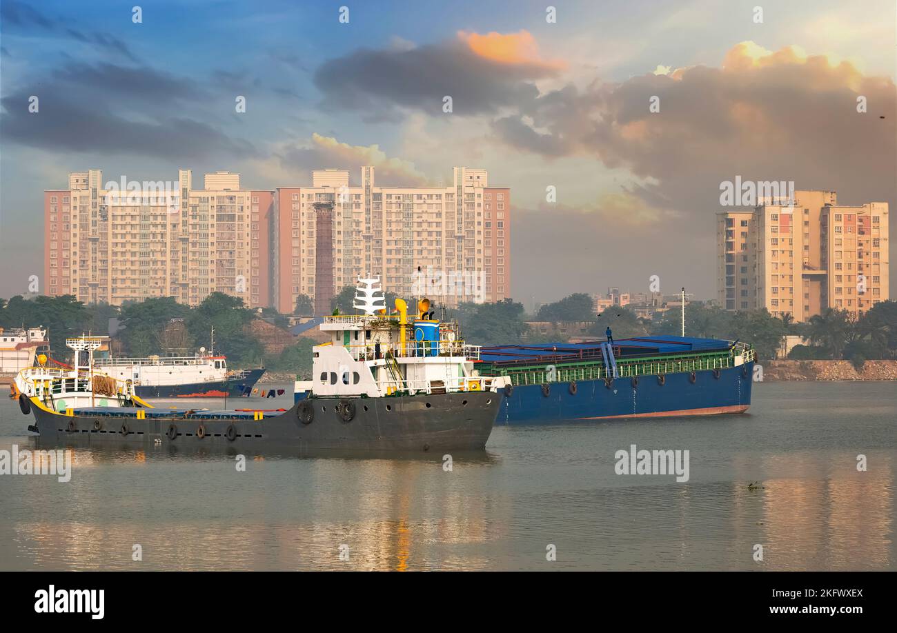 Cargo ship on river Ganges with view of Kolkata cityscape Stock Photo ...