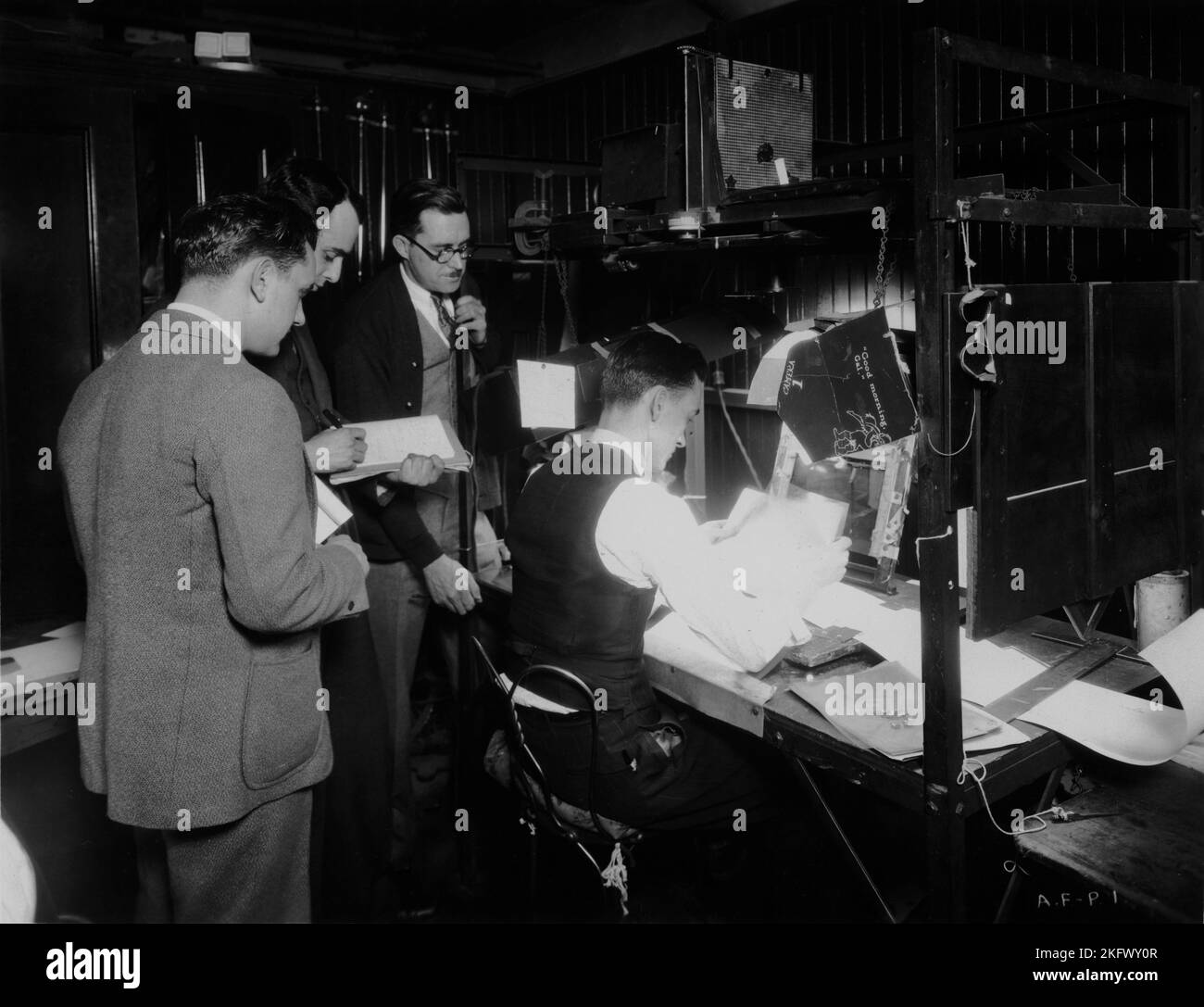 Author-Cartoonist HARRY BAILEY (with glasses) explains the animation ...